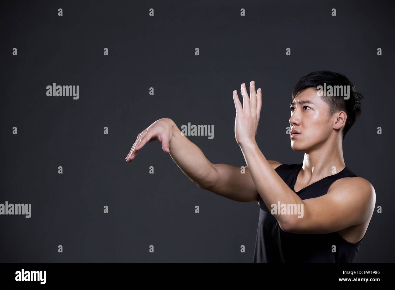 Young man shooting baskets Stock Photo - Alamy