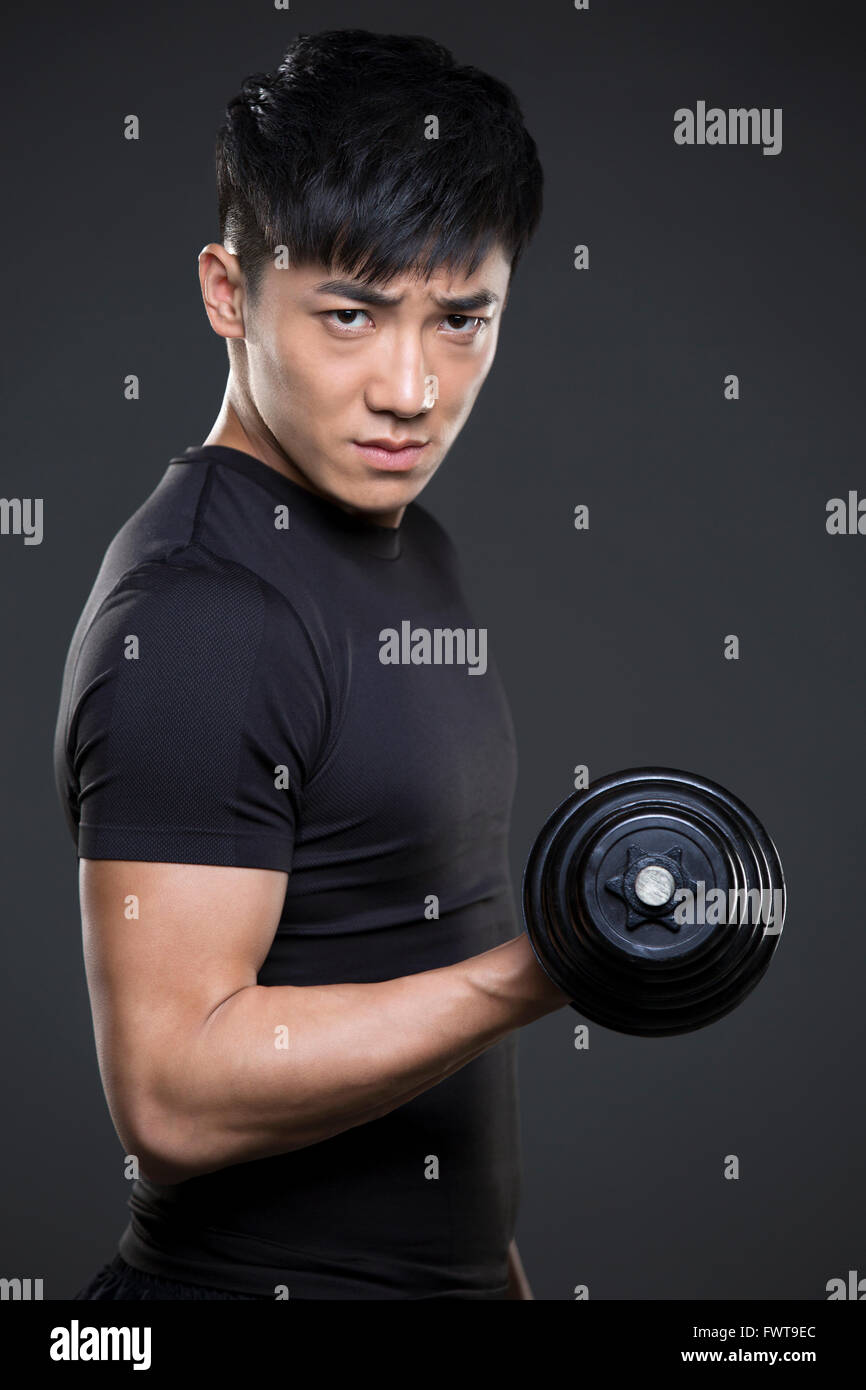 Man lifting heavy dumbbell crossfit hi-res stock photography and images ...