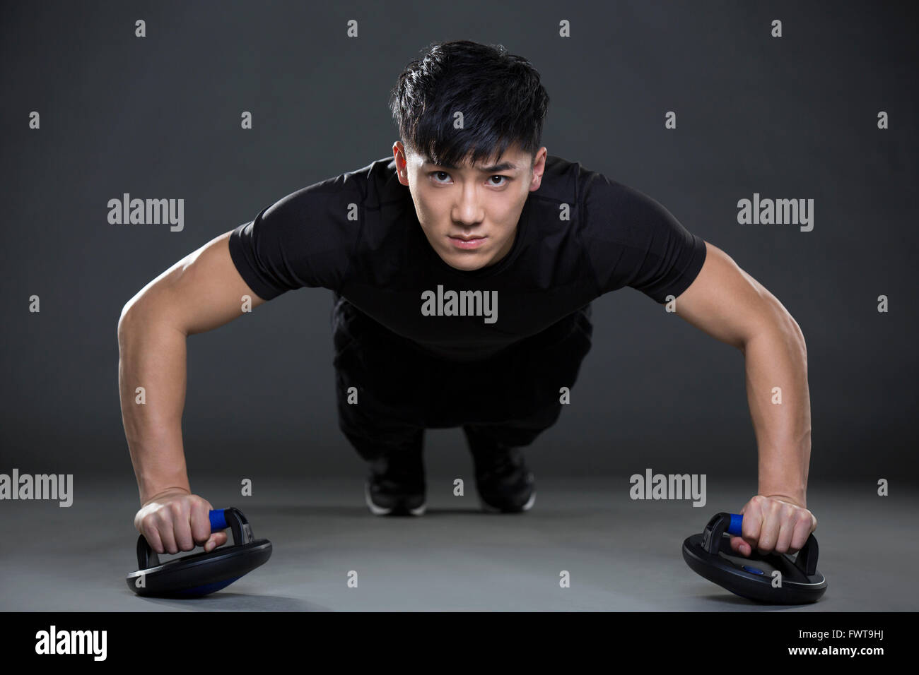 Young man doing push-ups Stock Photo - Alamy