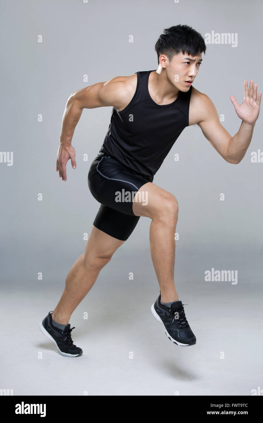Male athlete running Stock Photo - Alamy