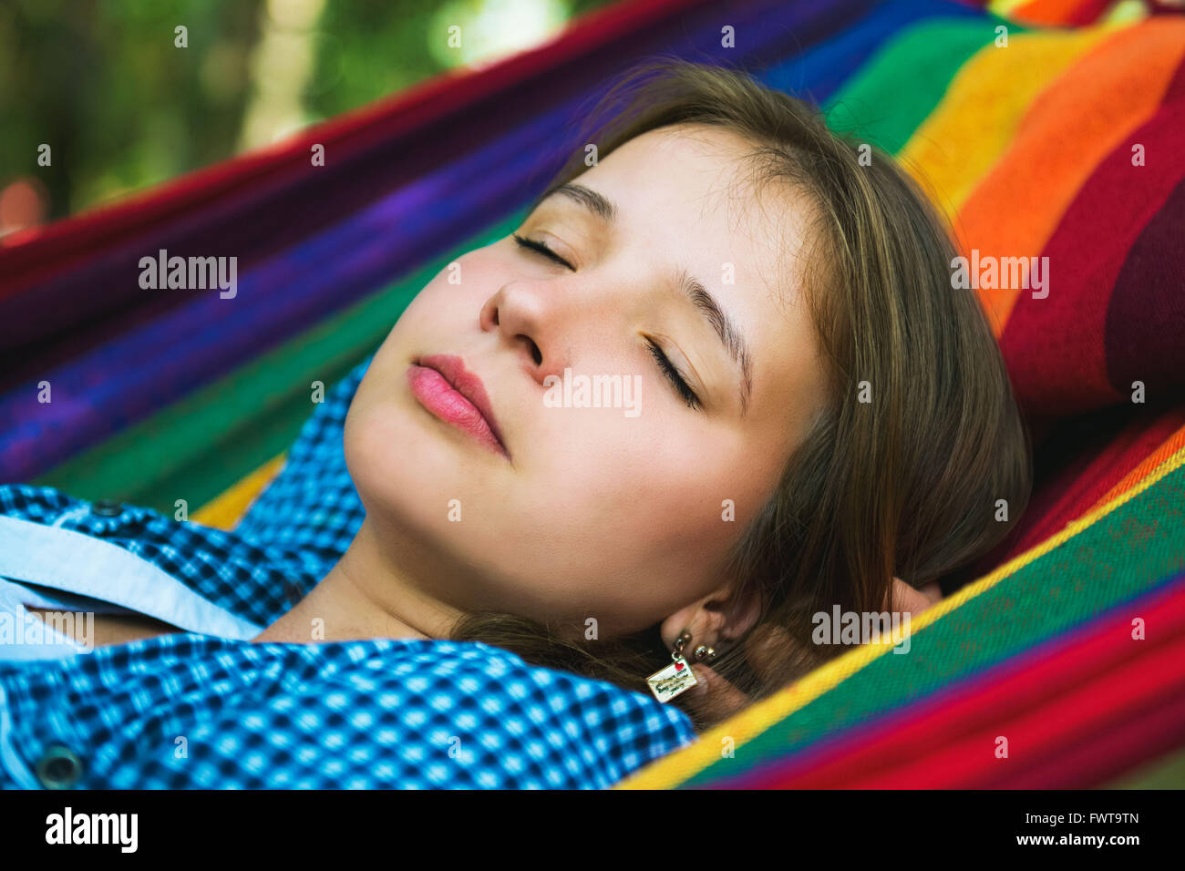 Sleep outdoors. Portrait of a beautiful sleeping woman Stock Photo - Alamy