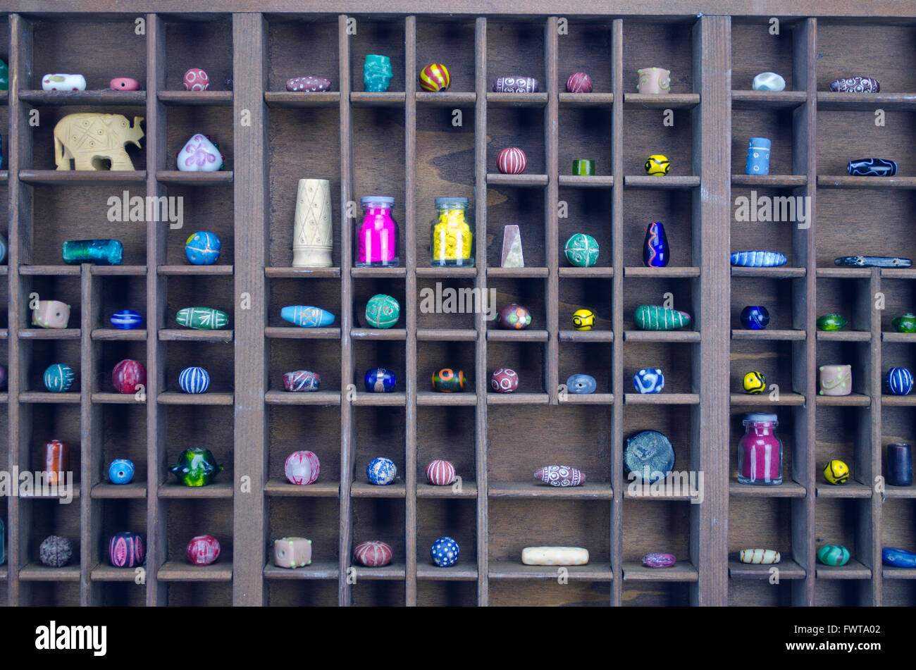 wooden shelf with souvenirs and beads from India Stock Photo - Alamy