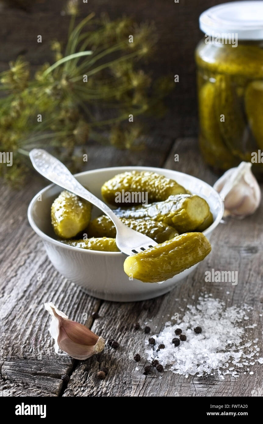 pickled cucumbers on a wooden background ( dark Stock Photo - Alamy