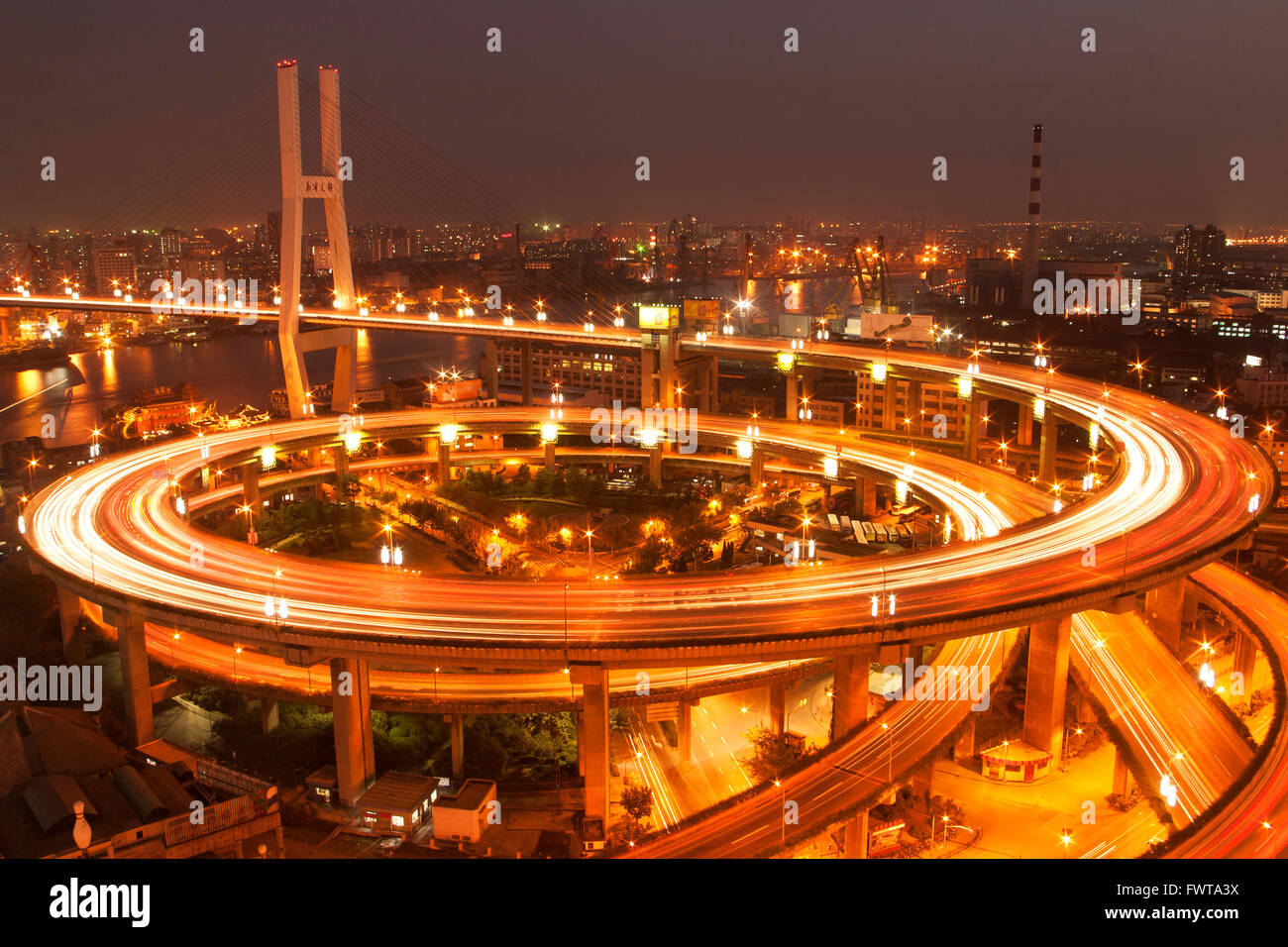 A nighttime view of the Nanpu Bridge in Shanghai, China, leading to the ...