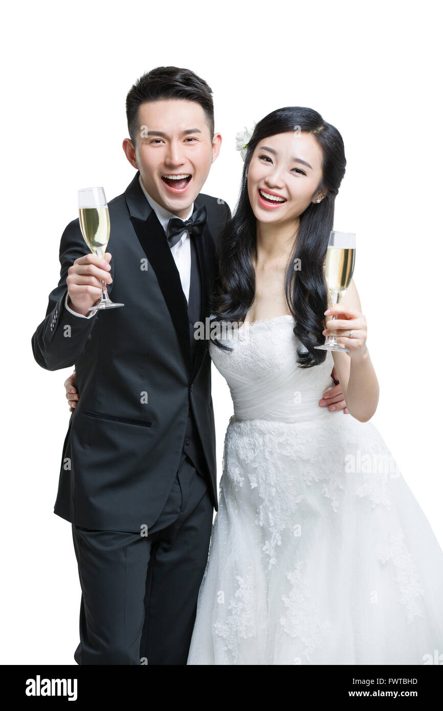 Happy bride and groom drinking champagne Stock Photo - Alamy