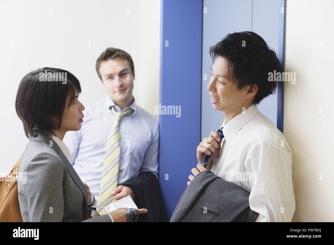 Multi-ethnic business people leaving the office Stock Photo - Alamy