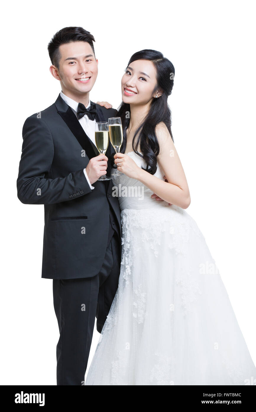 Happy bride and groom drinking champagne Stock Photo - Alamy