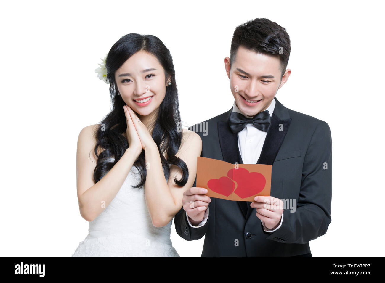 Happy bride and groom with love letter Stock Photo - Alamy