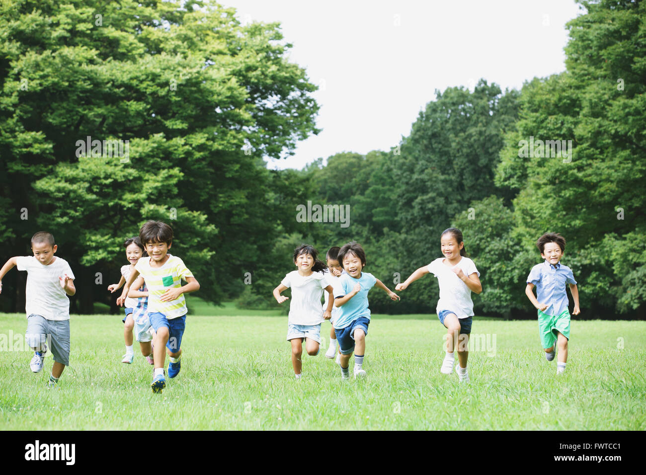 Japanese kids running in a city park Stock Photo - Alamy