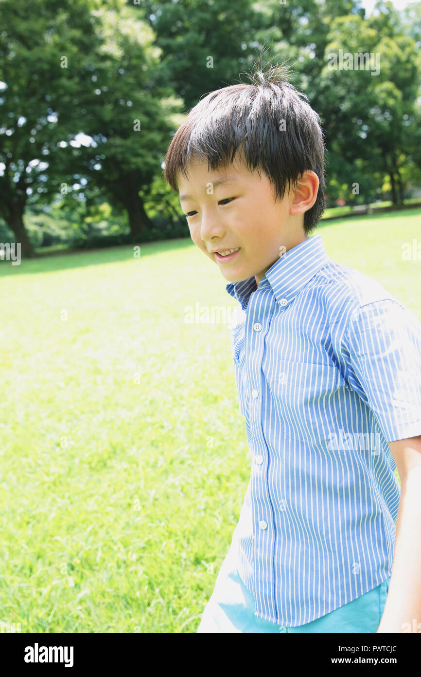 Japanese kid in a city park Stock Photo - Alamy