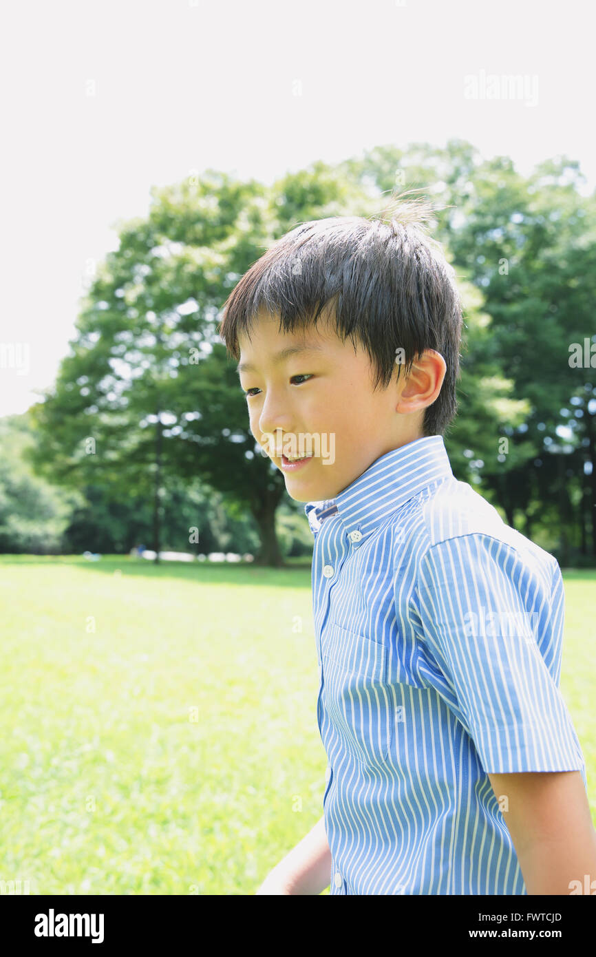 Japanese kid in a city park Stock Photo - Alamy