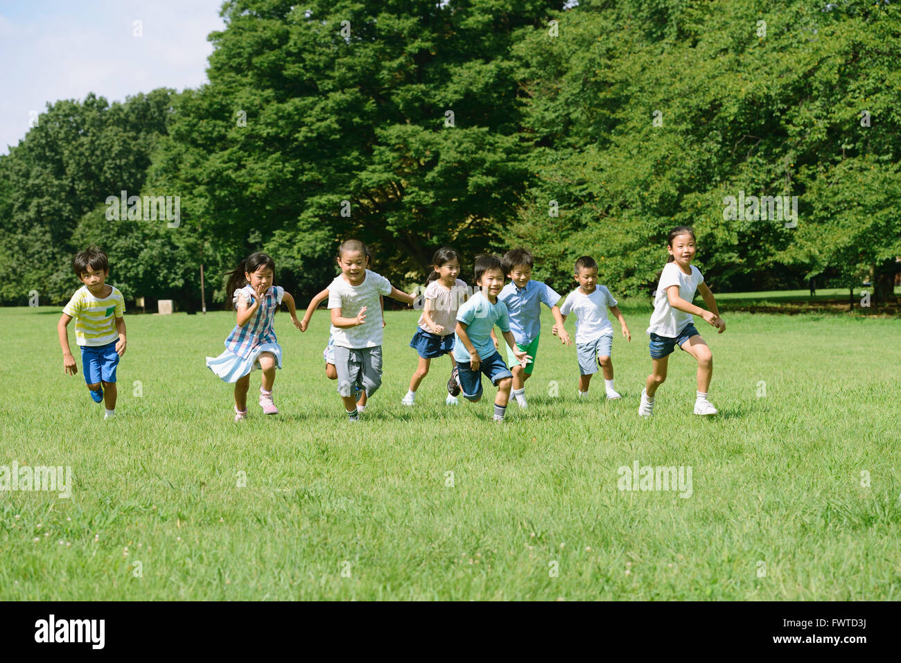 Japanese kids running in a city park Stock Photo - Alamy