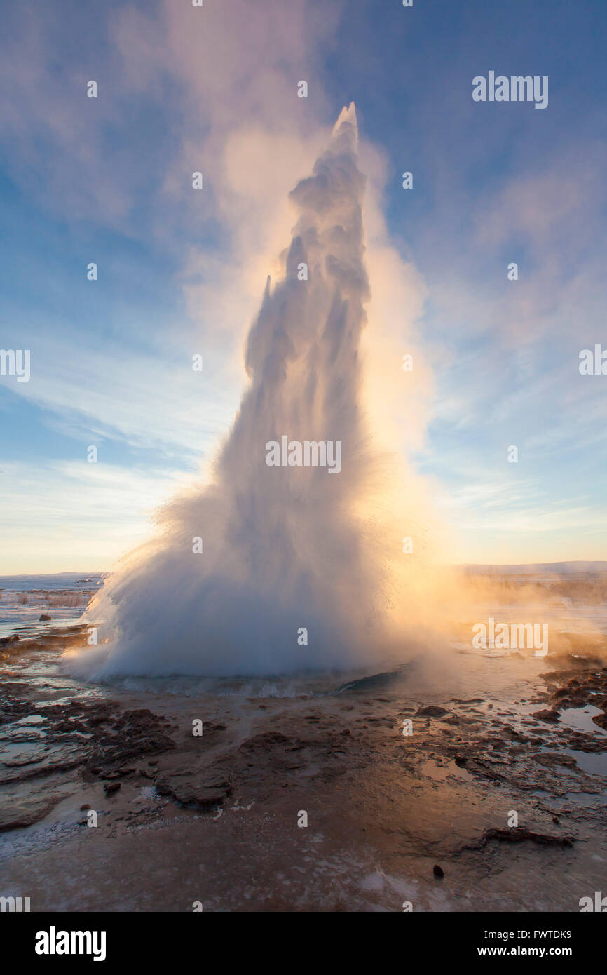 Eruption of Strokkur, fountain geyser in the geothermal area beside the ...