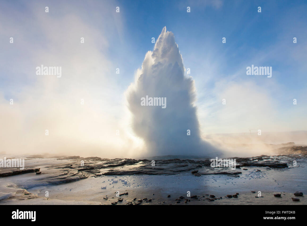 Eruption of Strokkur, fountain geyser in the geothermal area beside the ...