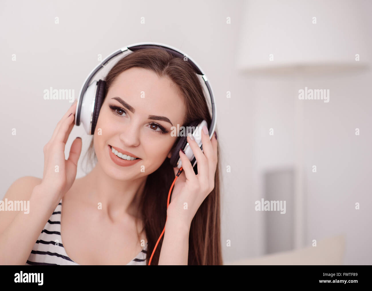Positive girl listening to music Stock Photo - Alamy