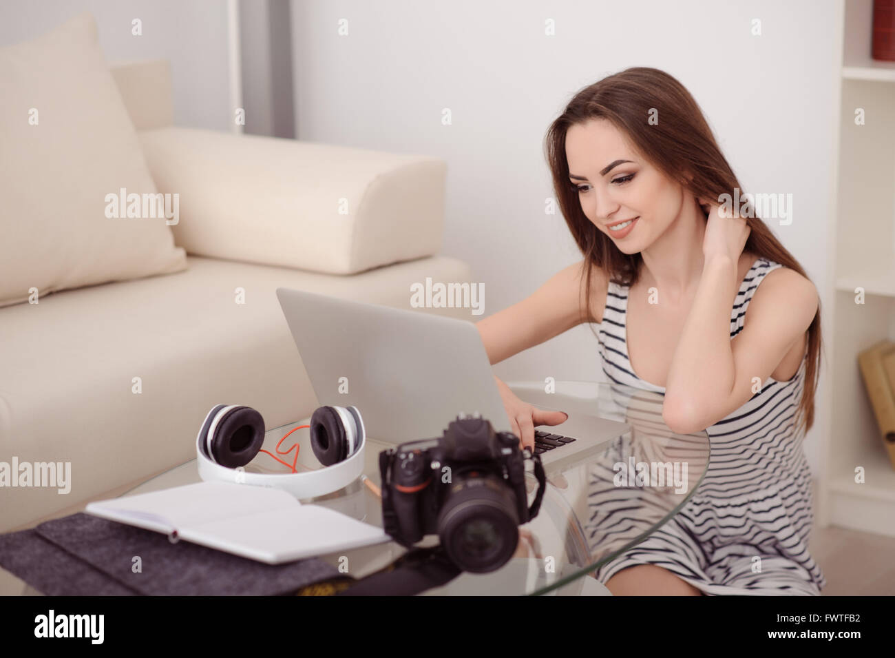 Nice girl using laptop Stock Photo - Alamy