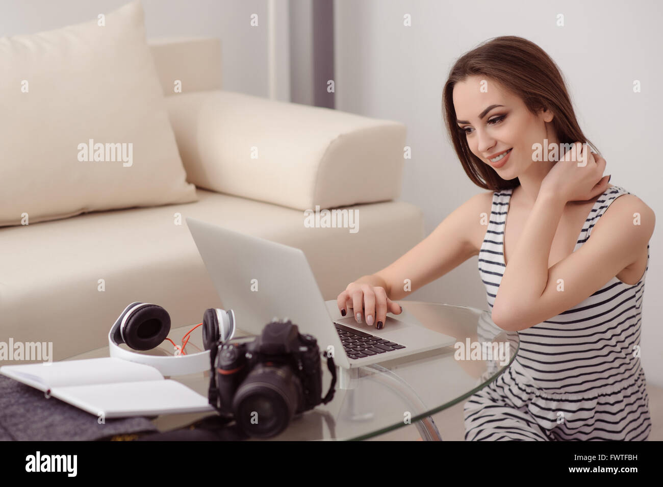 Nice girl using laptop Stock Photo - Alamy