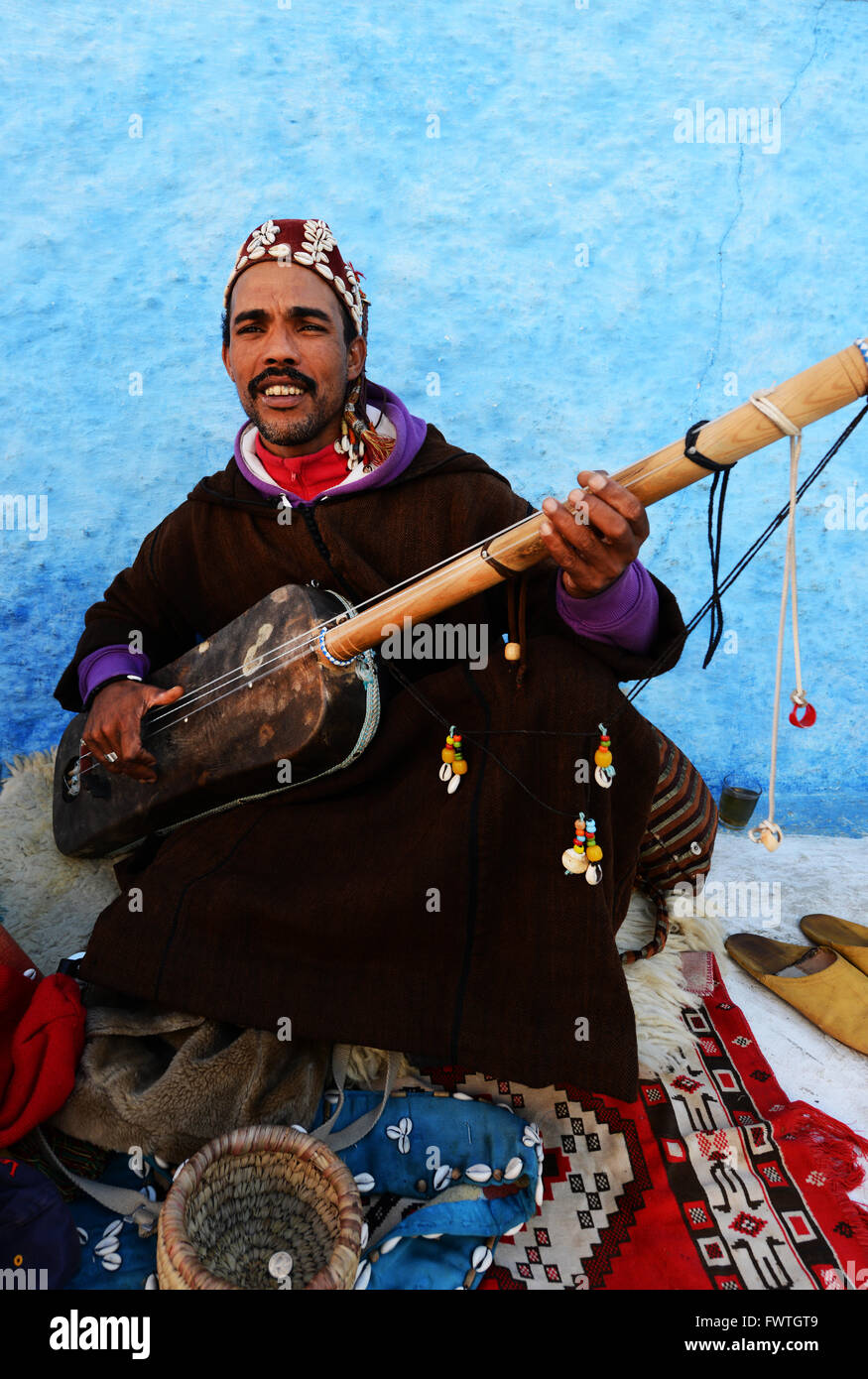 Gnawa musician playing sintir in hi-res stock photography and images ...