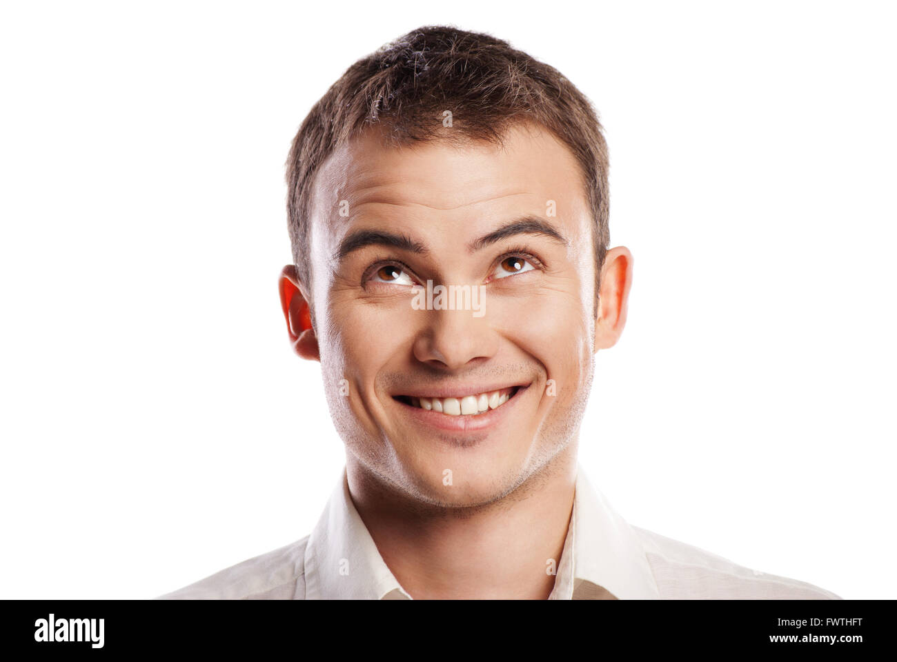 Handsome smiling young man looking up isolated Stock Photo - Alamy