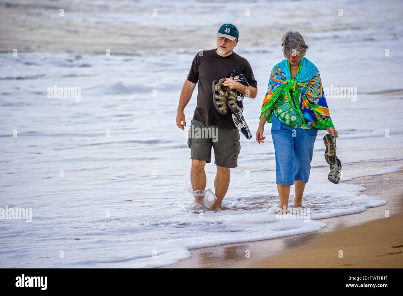 Couple on beach walk at dawn on Maui, Hawaii Stock Photo - Alamy