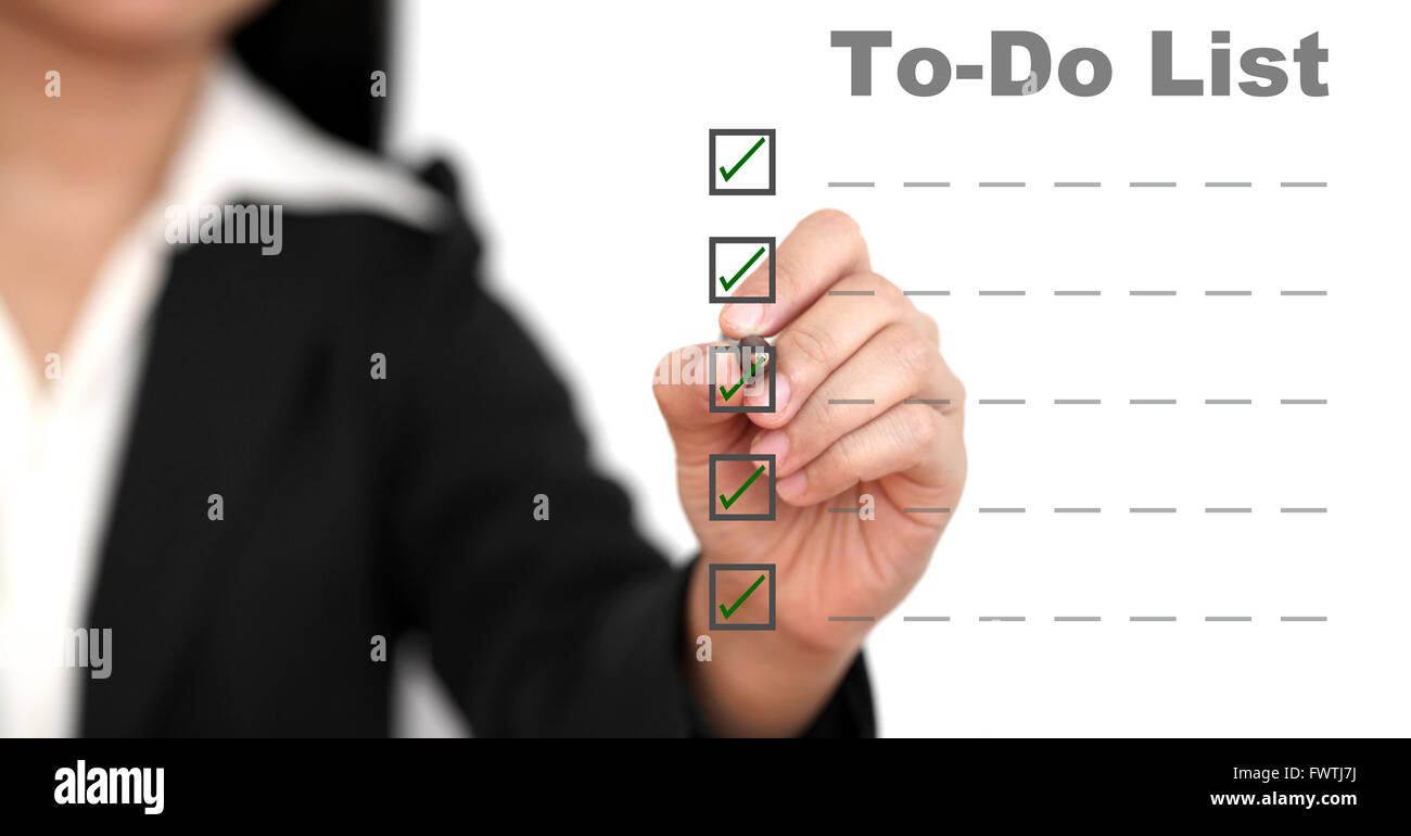 Asian business woman listing to do list Stock Photo - Alamy
