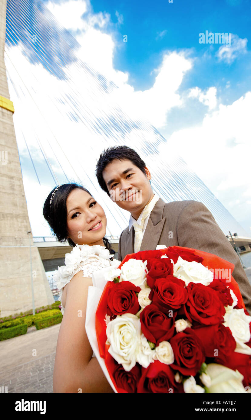 couples of happiness and romantic Bride and groom with beautiful rose ...
