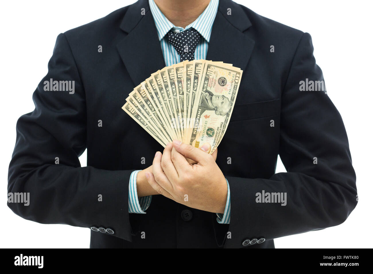 Businessman holding money isolated over white background Stock Photo ...