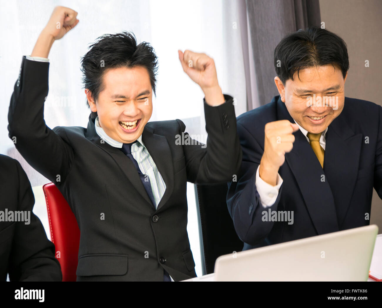 Businessmen celebrate their business success Stock Photo - Alamy