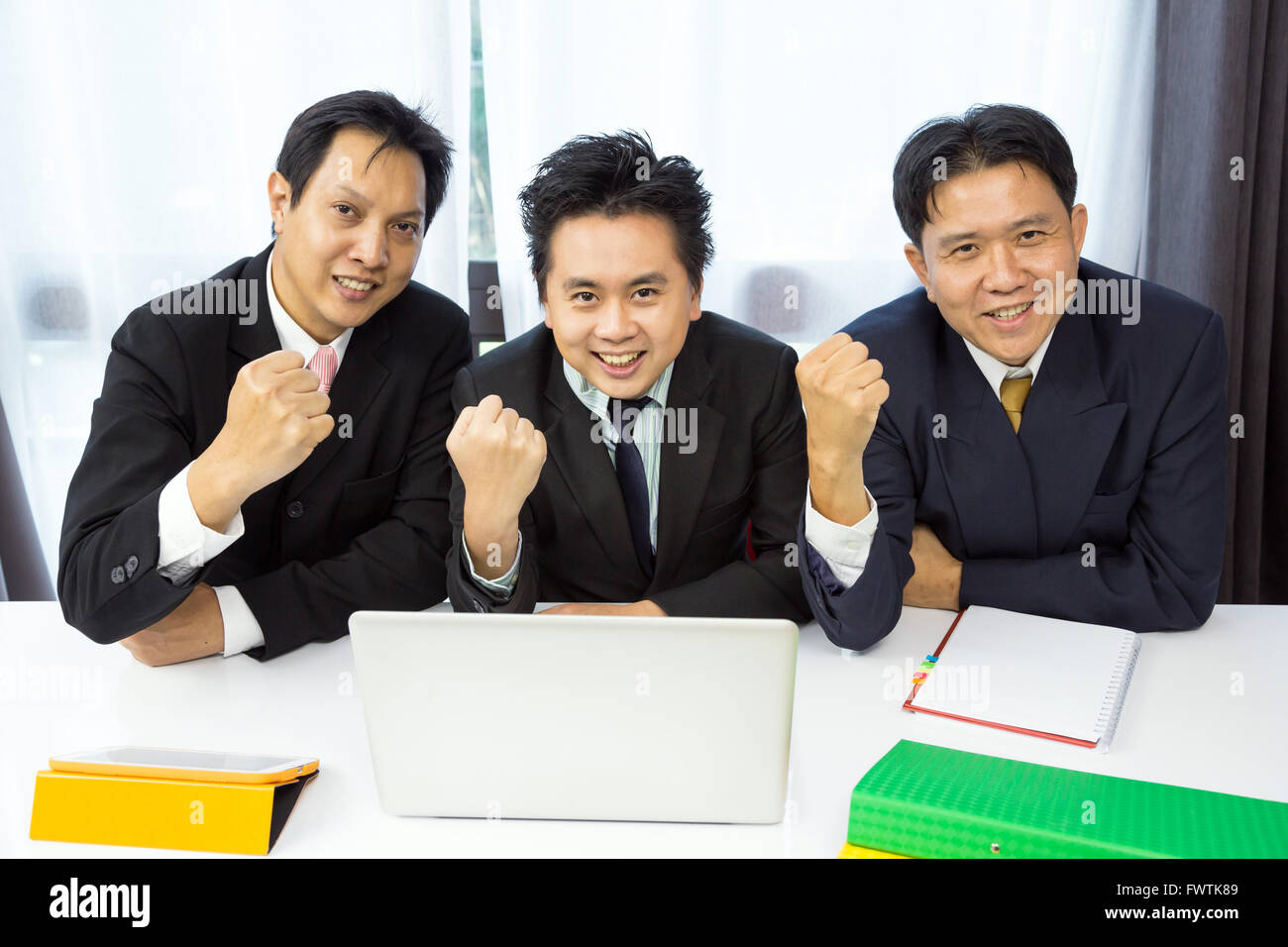 Businessmen celebrate their business success Stock Photo - Alamy