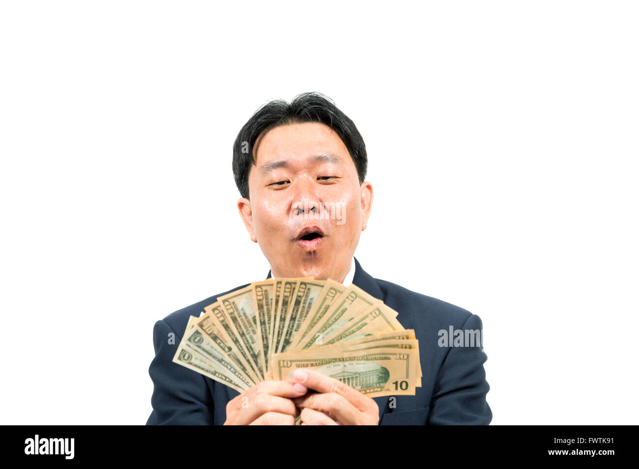 Businessman holding money isolated over white background Stock Photo ...