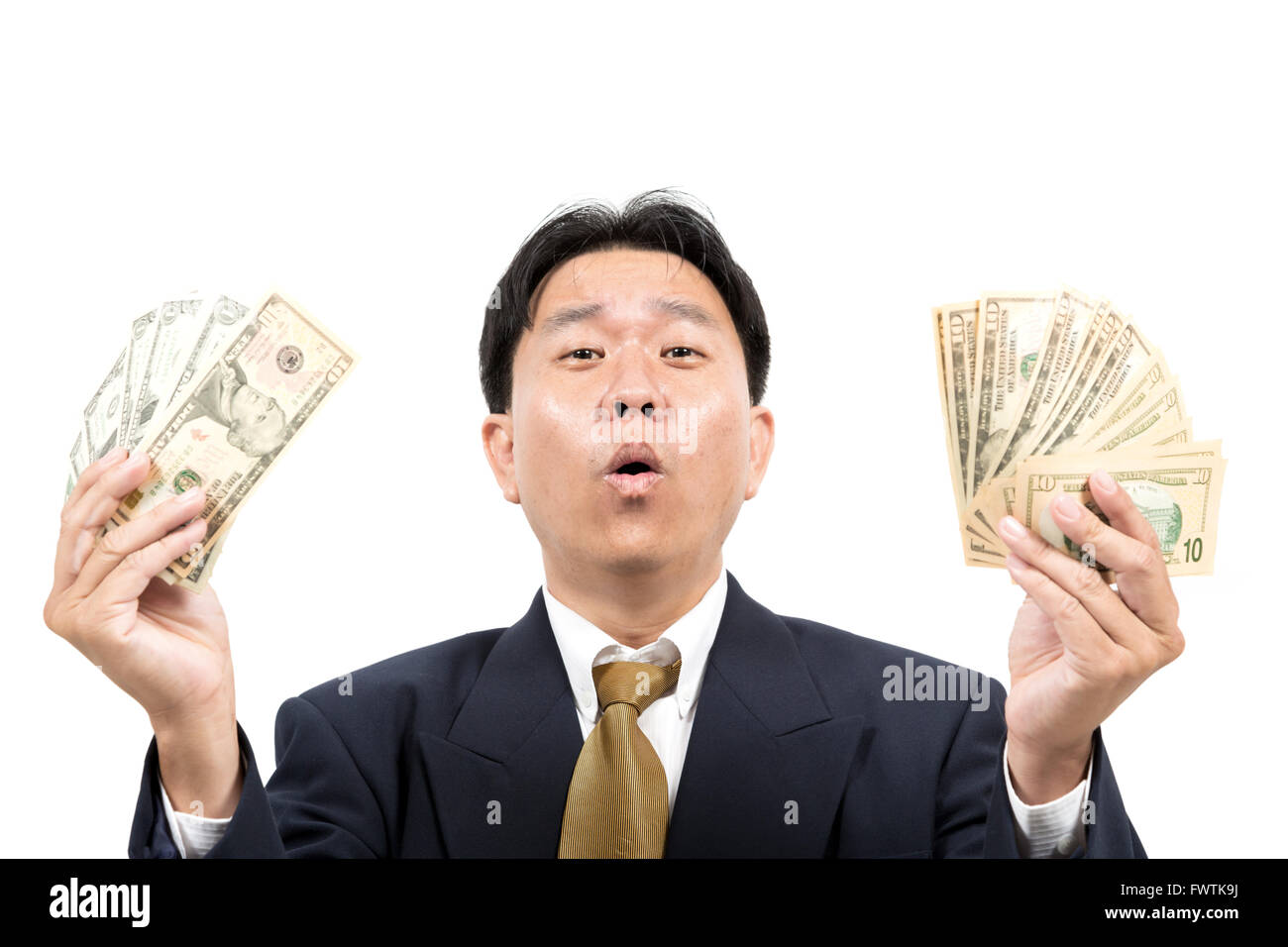 Businessman holding money isolated over white background Stock Photo ...