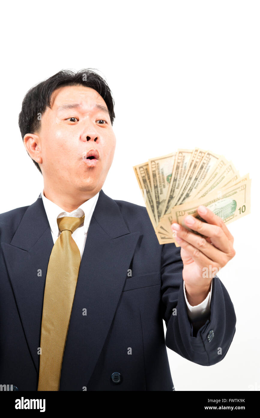 Businessman holding money isolated over white background Stock Photo ...