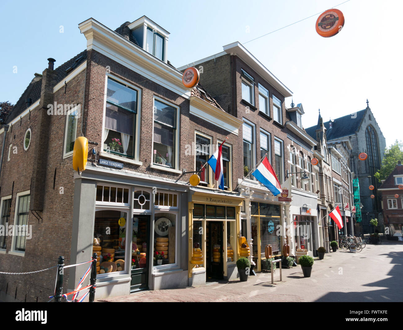 Shopping street with shops selling Dutch cheese in the historic city ...