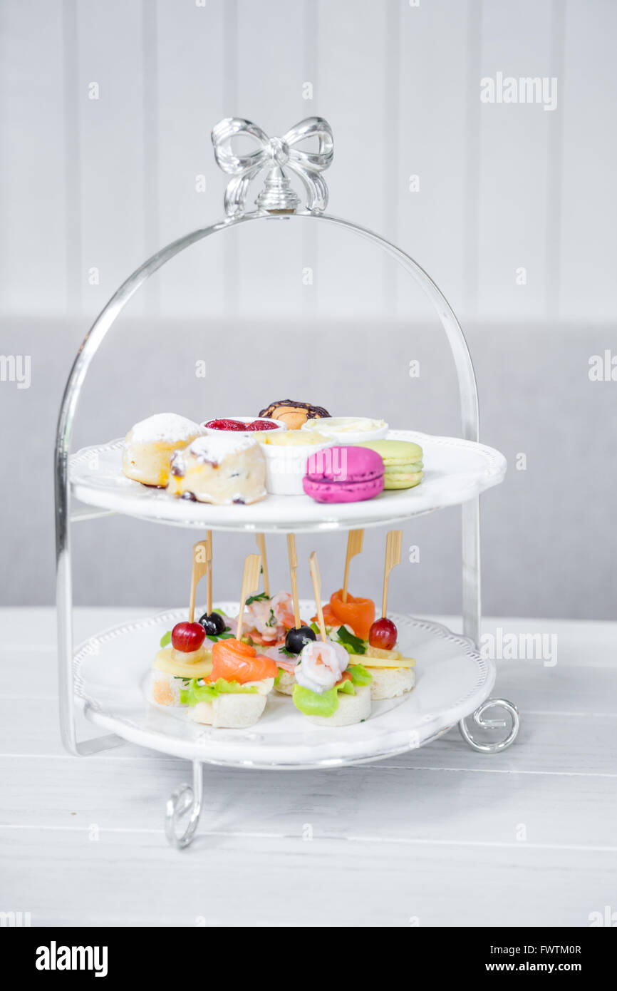High Tea set with macaroons and Seafood cocktail Stock Photo - Alamy