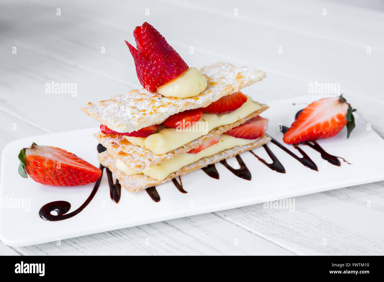 Strawberry Mille Feuille cake in white plate Stock Photo - Alamy