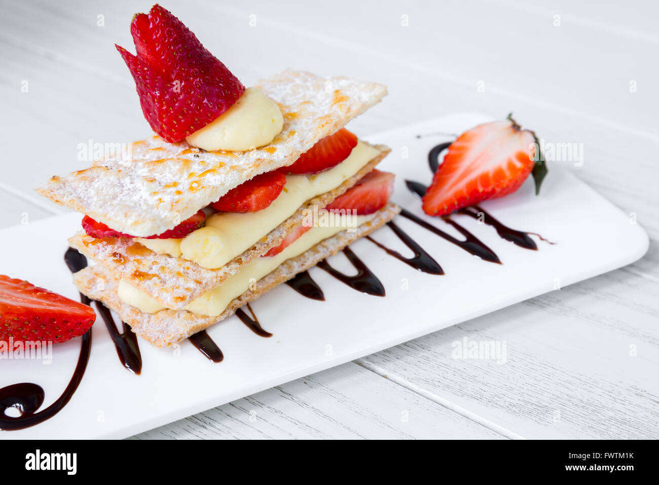 Strawberry Mille Feuille cake in white plate Stock Photo - Alamy