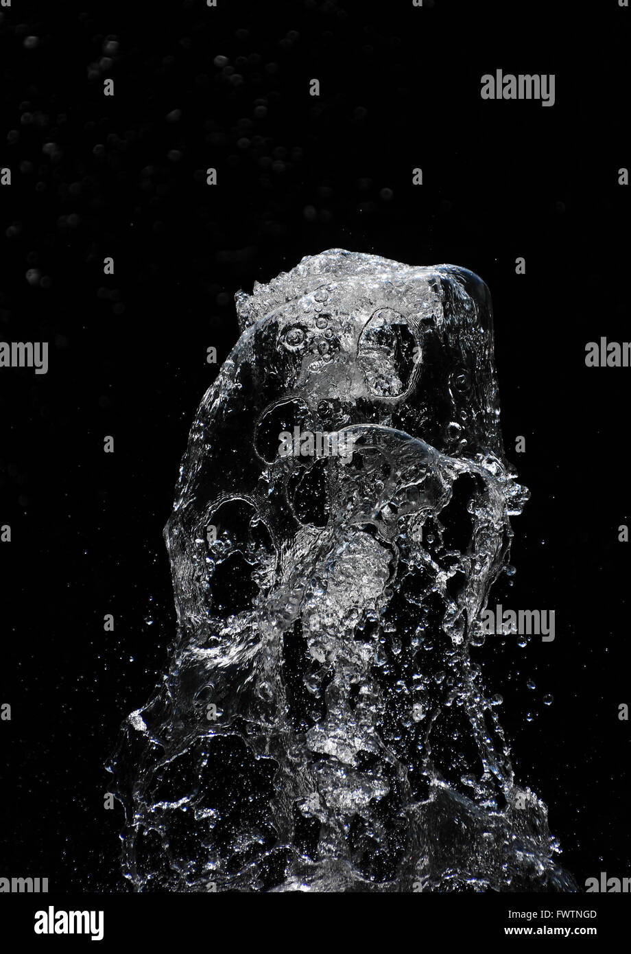 Fountain transparent water stream, splash and drops in motion over ...