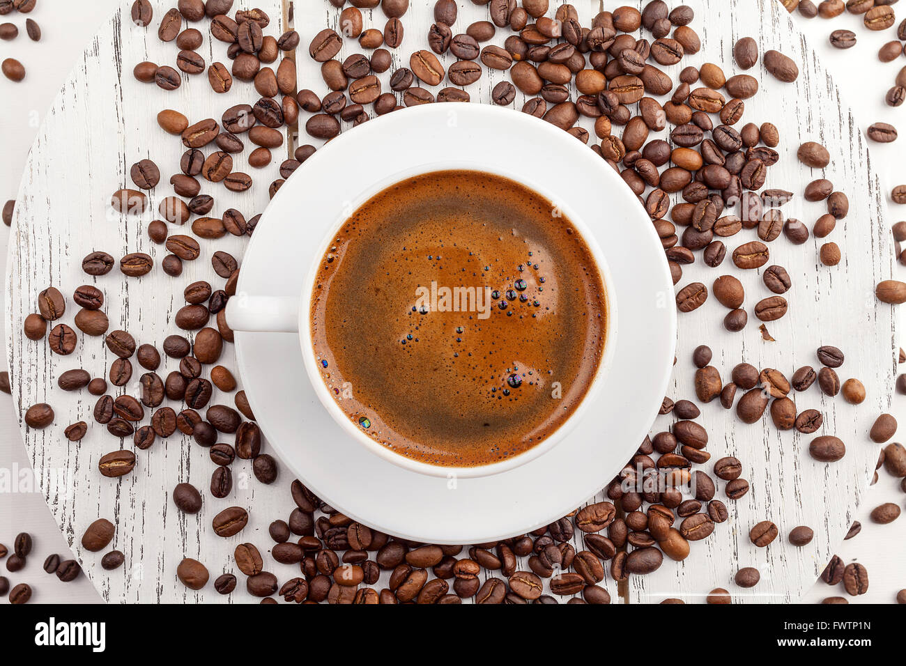 Coffee cup and beans on a white background Stock Photo - Alamy