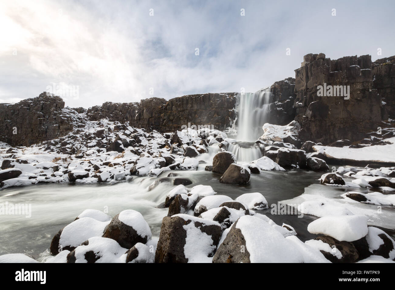 Oxararfoss Waterfall in the winter in pingvellir valley National Park ...