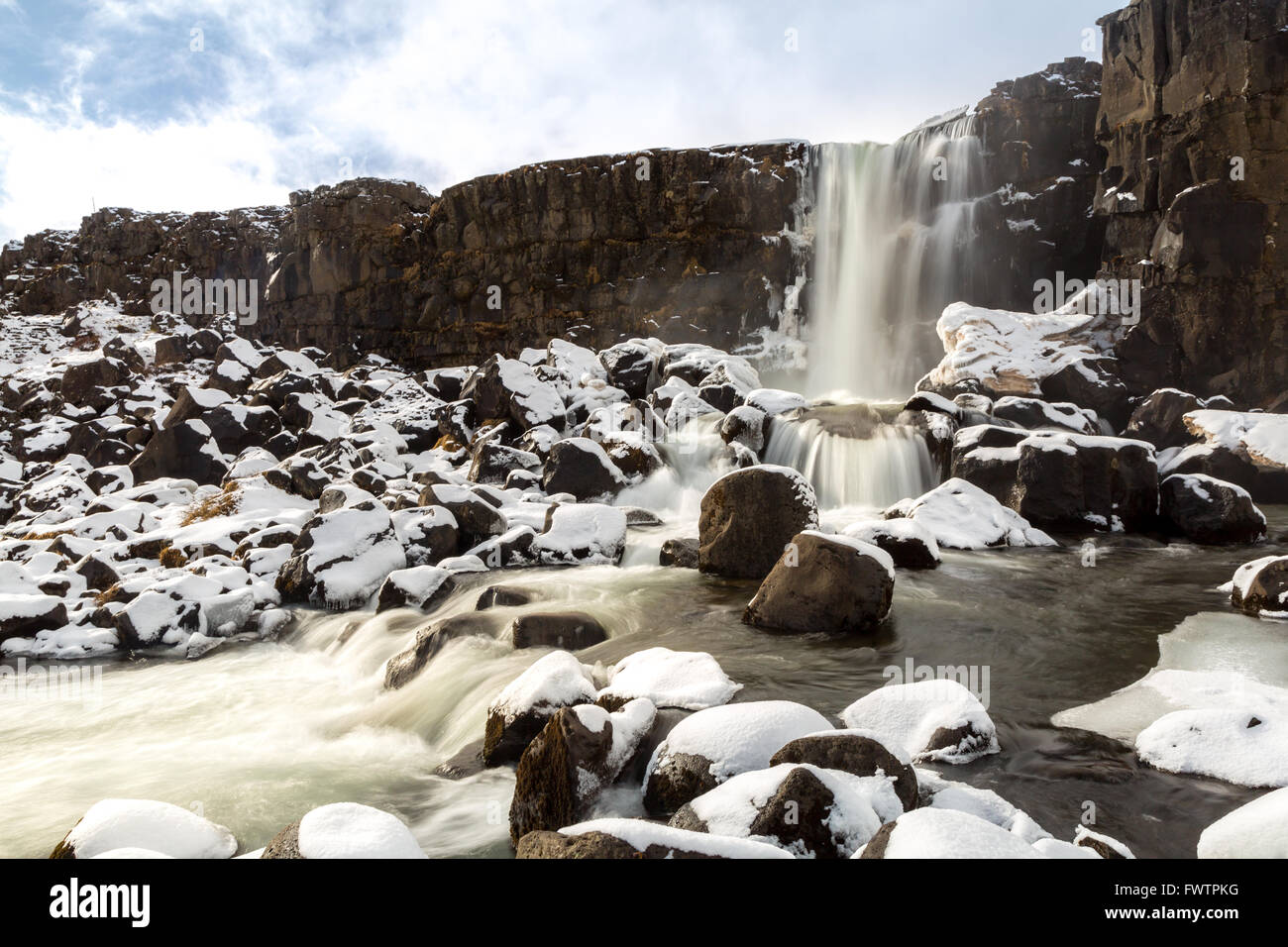 Oxararfoss Waterfall in the winter in pingvellir valley National Park ...