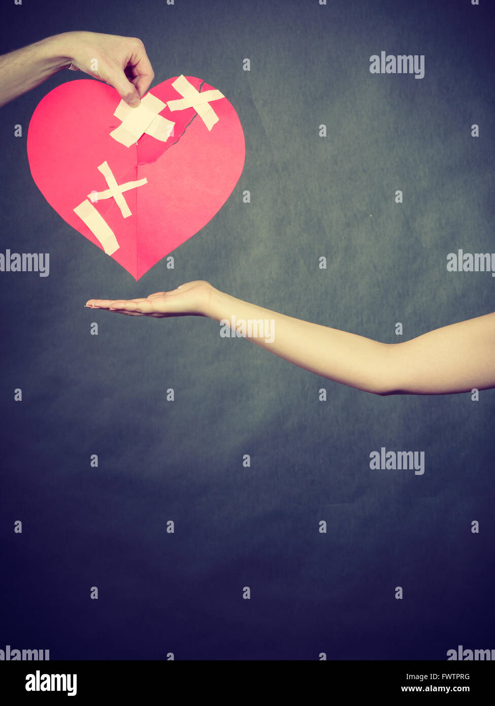 Broken heart difficult love concept. Couple woman and man hands holding ...