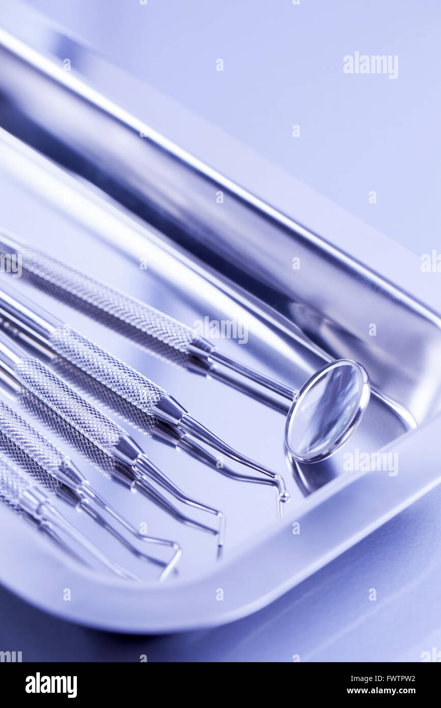 Professional dental tools in a sterile medical light Stock Photo - Alamy