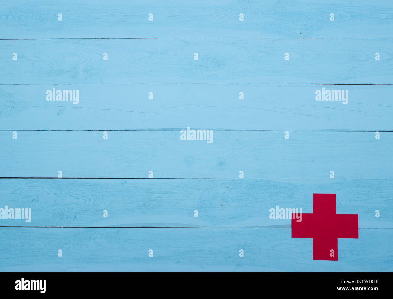 velvet paper red cross on a blue background of rough planks Stock Photo ...