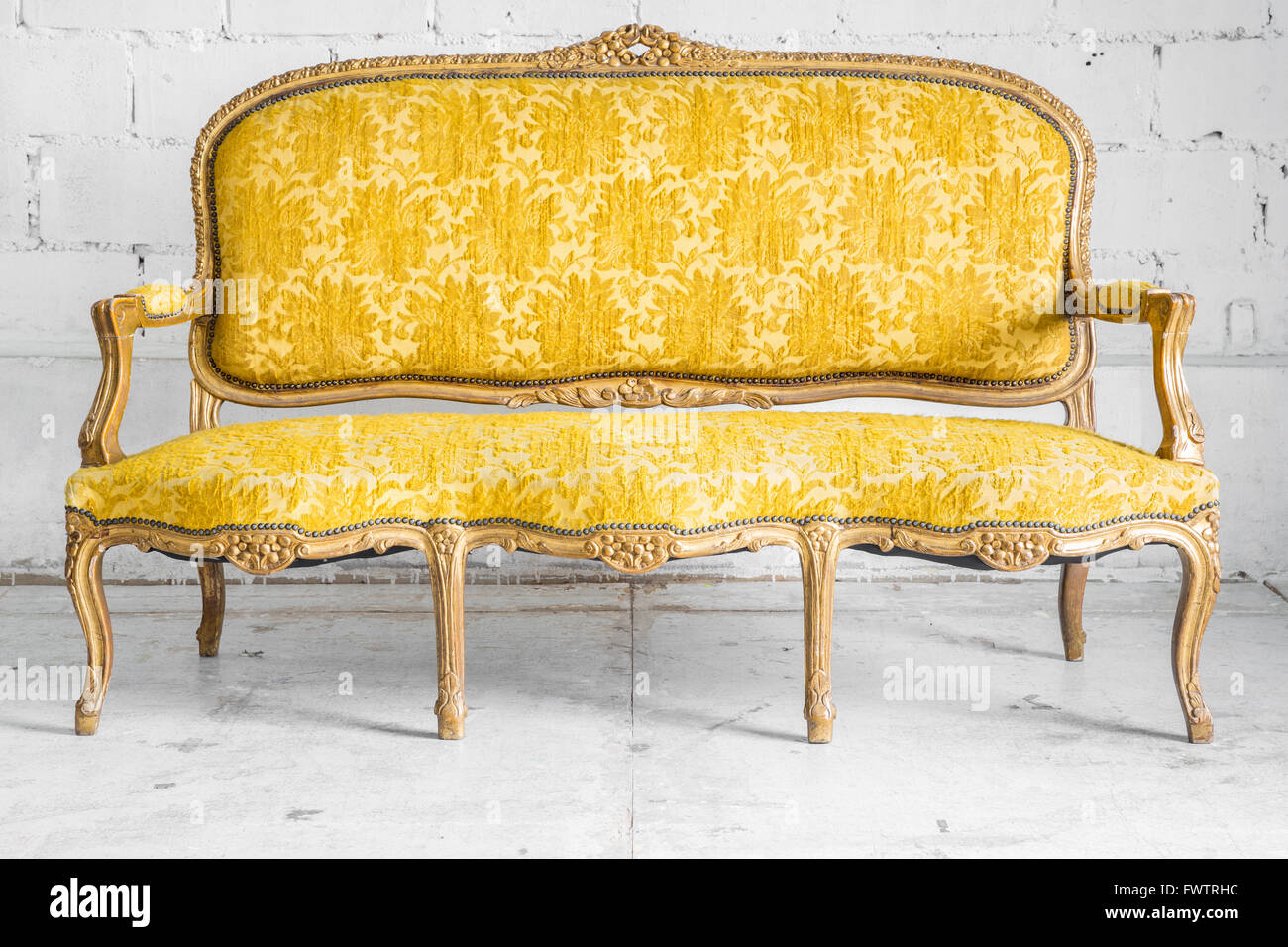 Yellow Retro classical style Armchair sofa couch in vintage room Stock ...