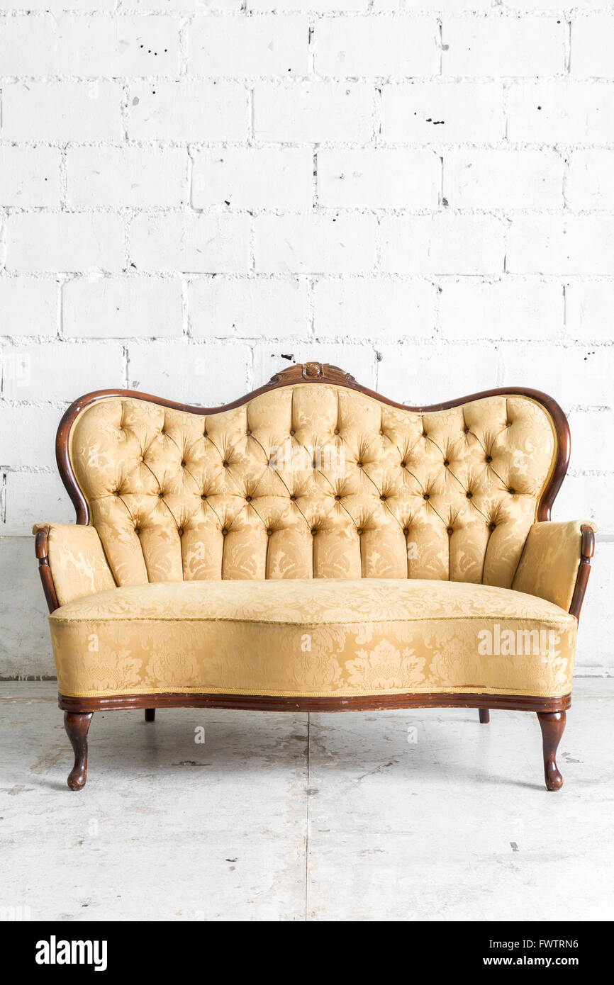 Brown Retro classical style sofa couch in vintage room Stock Photo - Alamy