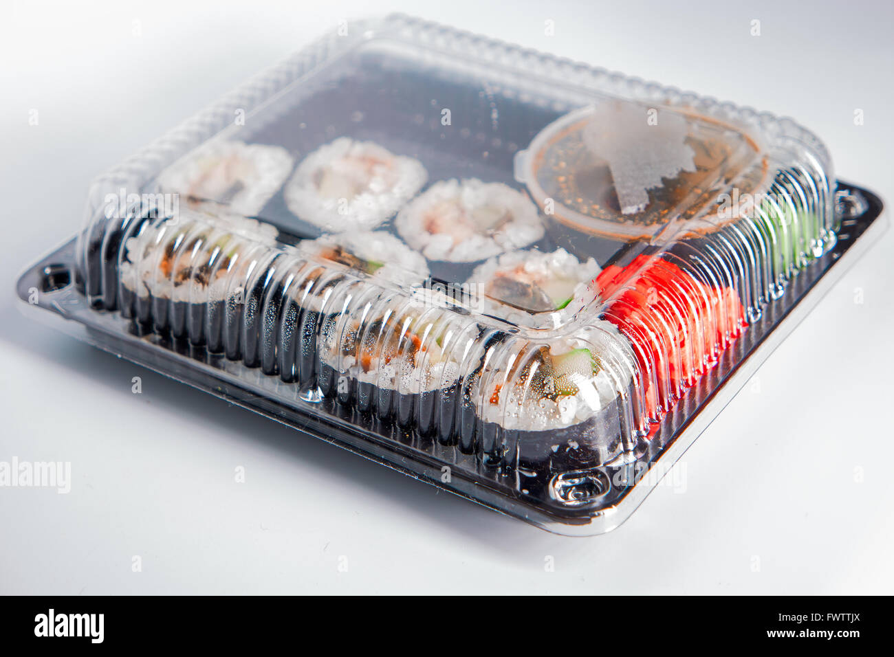 Sushi delivery box on white background Stock Photo - Alamy