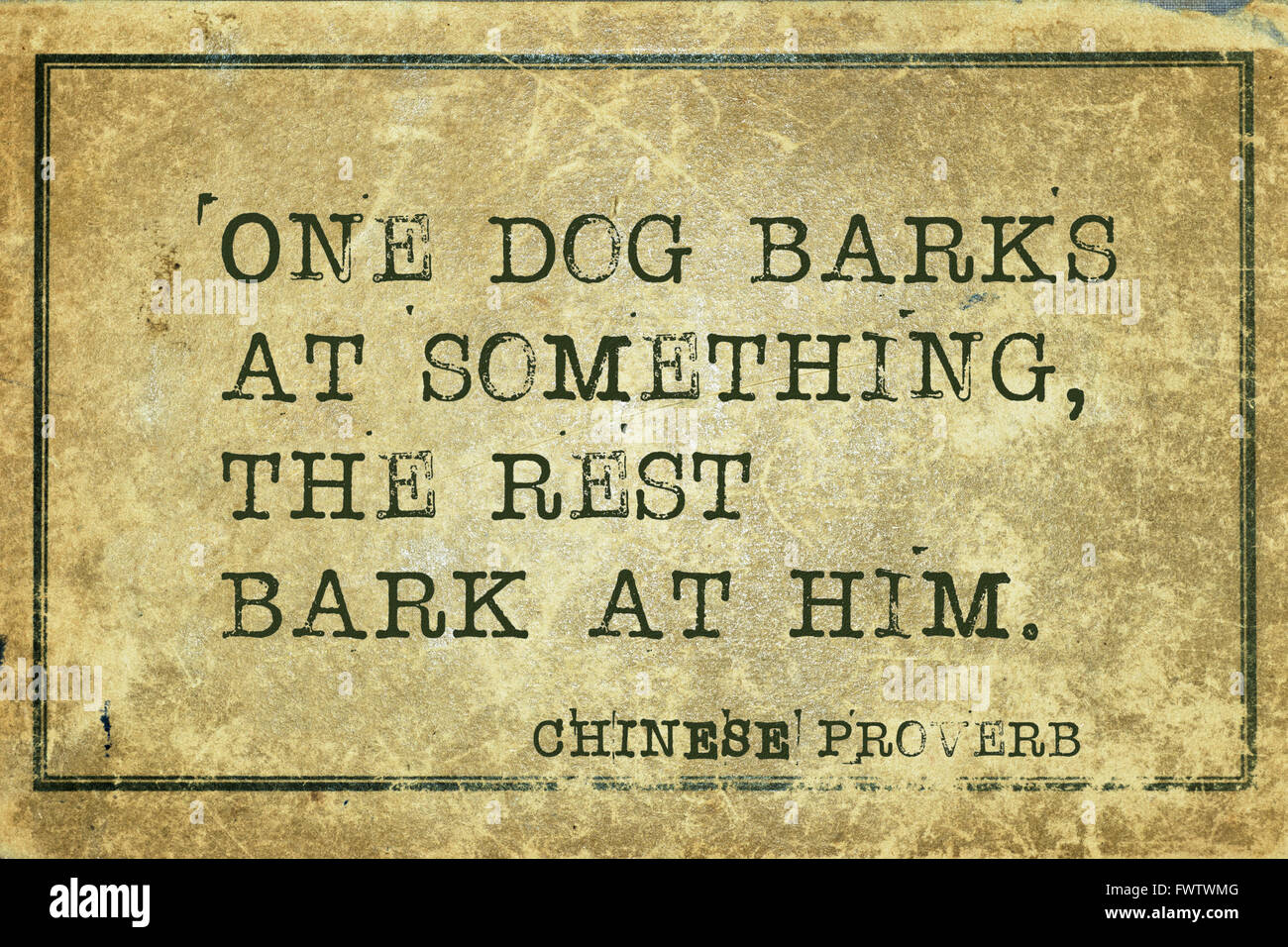 One dog barks at something - ancient Chinese proverb printed on grunge ...