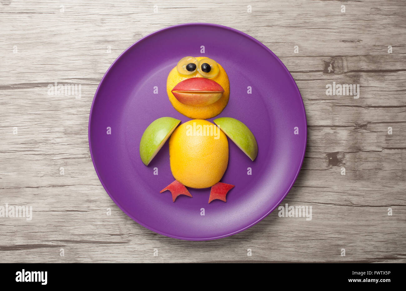 Amusing penguin made of fruits on plate Stock Photo - Alamy