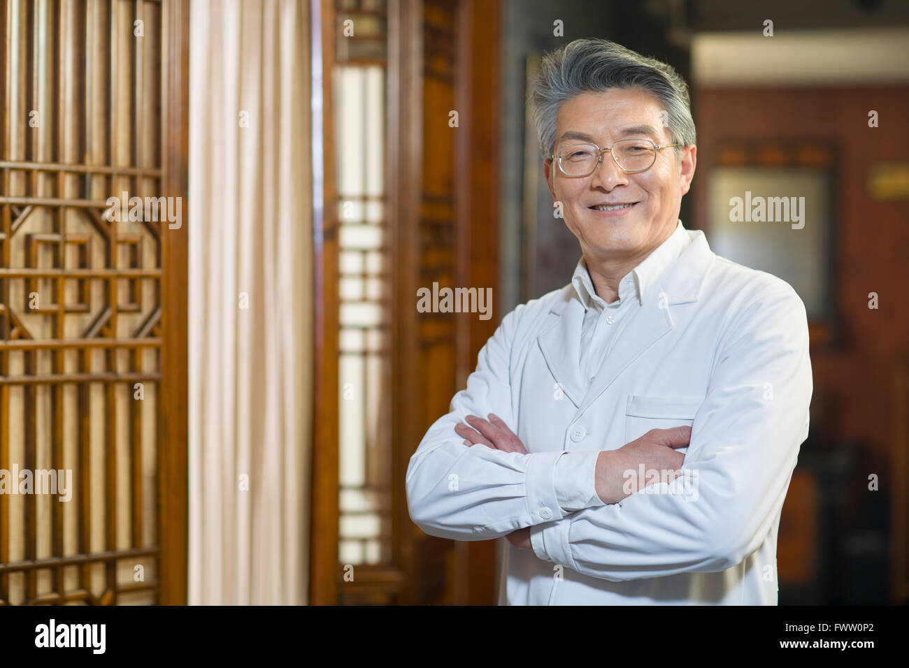 Portrait of senior Chinese doctor Stock Photo - Alamy