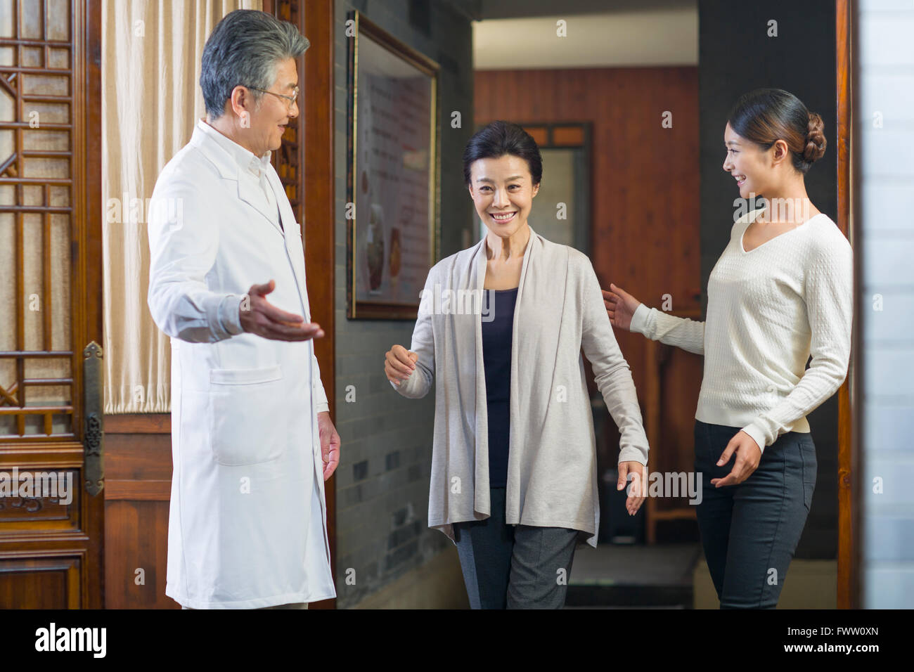 Senior Chinese doctor and patient Stock Photo - Alamy